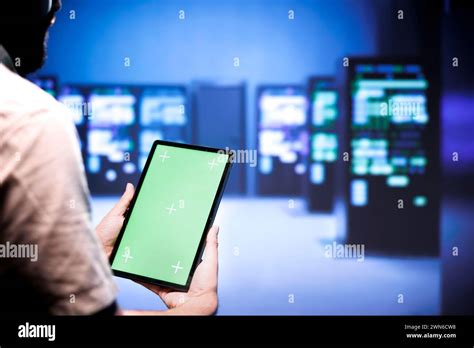 computer scientist using green screen device to verify data center hardware configuration