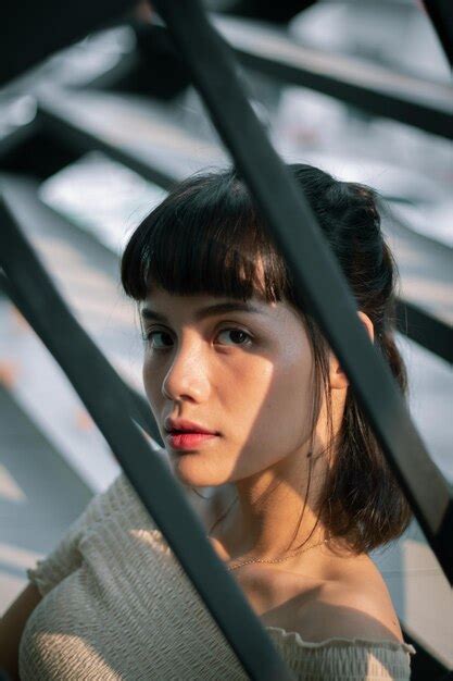 Premium Photo Portrait Of Young Woman Looking Down