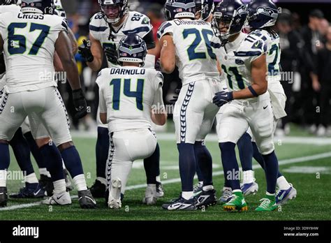 Seattle Seahawks Quarterback Sam Darnold 14 Huddles With His Team
