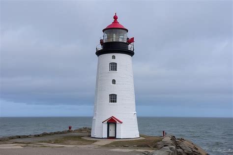 Guiding The Maritime Seas Lighthouse Beacon Premium Ai Generated Image