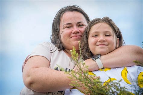Premium Photo In Summer An Overweight Mother And Daughter Stand