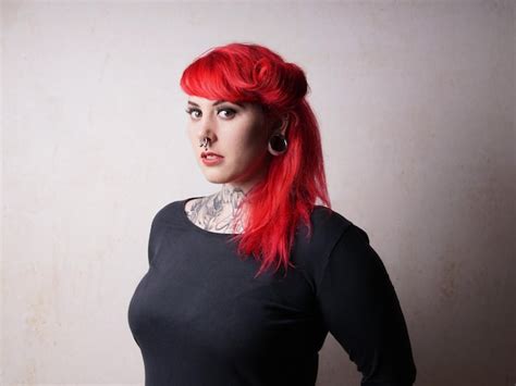 Premium Photo Portrait Of Young Woman With Redhead Standing Against Wall