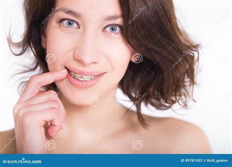 Beautiful Girl With Perfect Skin And Multi Colored Braces Posing On White Backgraund Stock Image