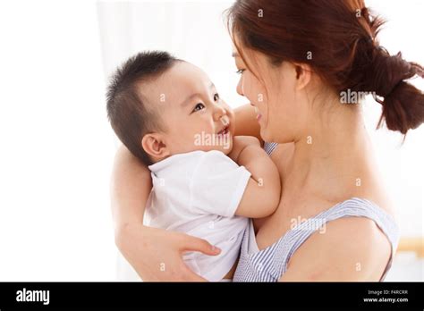 Mother Holding The Baby Stock Photo Alamy