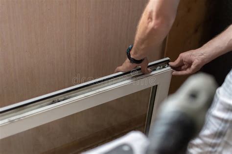 Repair Of PVC Windows Installing A New Pvc Window Mechanism Selective Focus Shallow Depth Of