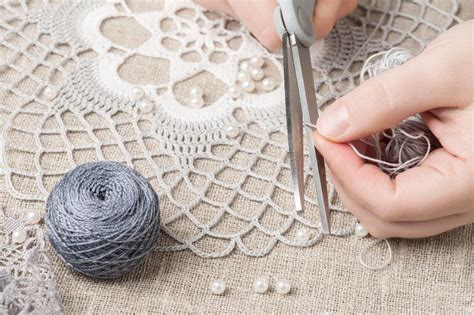 Female Hands Cutting Thread Stock Photo Image Of Pearl Horizontal