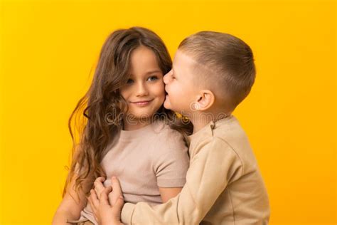 Older Brother And Younger Sister Hugging