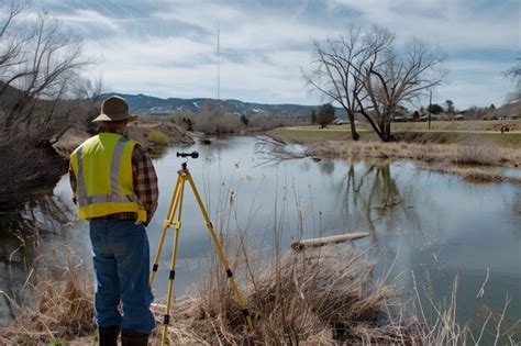 Premium Photo Conducting Flood Control Project Surveys Ar Generative Ai