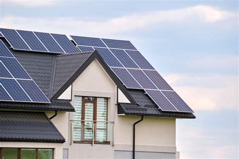 Premium Photo Private Home Roof Covered With Solar Photovoltaic Panels For Generating Of Clean