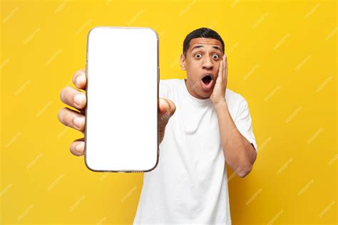 Premium Photo Young Shocked African American Guy In White Tshirt
