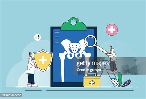 Two Male Doctors Examining Hip Bone Fluoroscopy Orthopedic Health Protection Concept