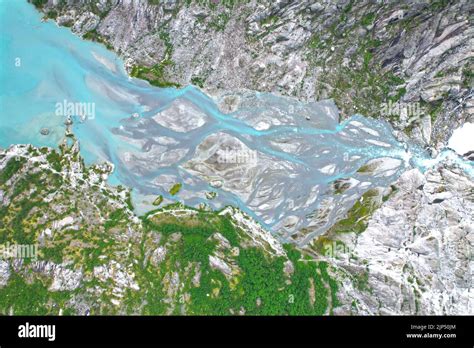 River Forming Mountain Landscape Aerial Birds Eye View In Norway Europe