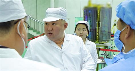 North Korea Shows Kim Jong Un Examining A Military Spy Satellite That