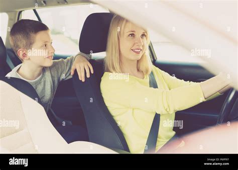 Young Mother And Son Driving In City During Sightseeing Tour Stock