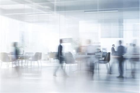 Premium Ai Image Blurred Business People Working And Talking In An Office