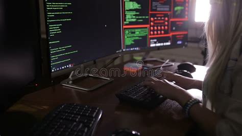 Female Hands Typing Computer Code Hacking Computer At A Dark Room