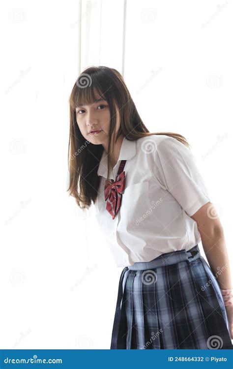 Portrait Japanese School Girl Uniform In White Tone Bed Room Stock