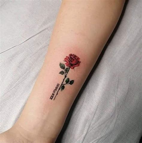 Small Rose Tattoo On Wrist With Name Meaningful And Elegant Design