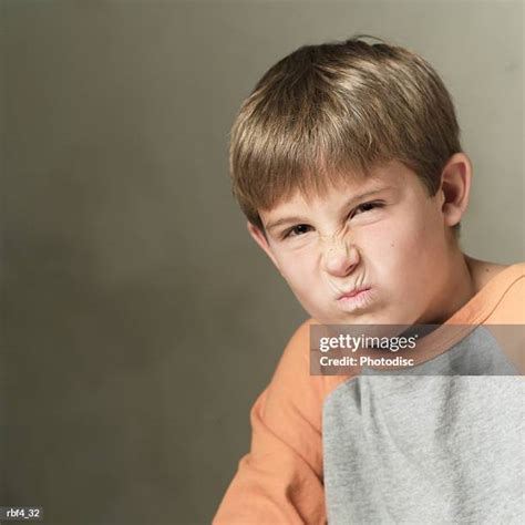 Boy Grimacing At Camera Photos Et Images De Collection Getty Images