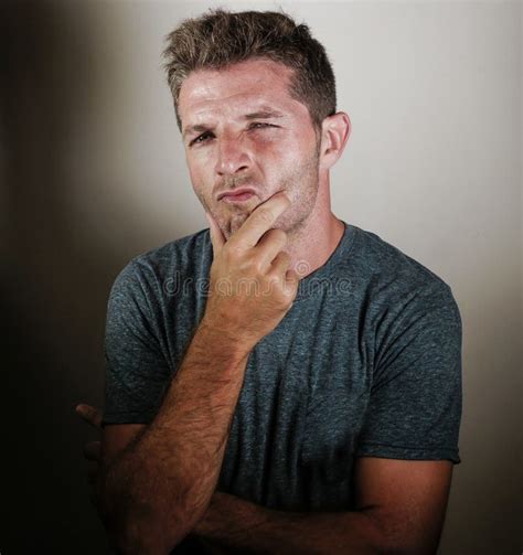 Portrait Of Young Attractive Thoughtful Man Thinking Looking Pensive