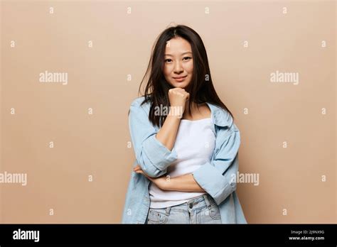 Cute Smiling Thoughtful Tanned Adorable Young Asian Lady Reclines On