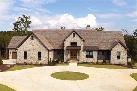 Plan 24427tw Expansive Stone And Wood House Plan With Dual Master