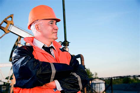 Engineer In An Oil Field Safety Pipeline Industrial Photo Background And Picture For Free