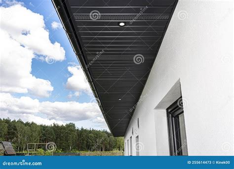 A Modern Graphite Roof Lining Is Attached To The Trusses Visible