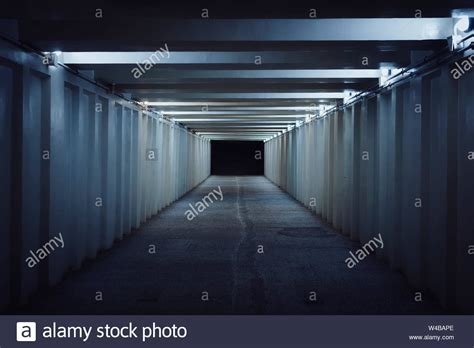 Underground Pedestrian Crossing A Long Concrete Tunnel With Lanterns