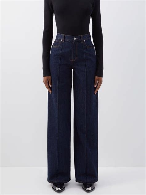 Alexander Mcqueen Tailors These Dark Wash Blue Jeans To A Flattering Wide Leg Accentuated With