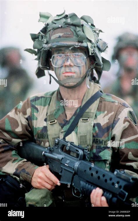 A Soldier Of The 7th Light Infantry Division Carries An M 16a2 Rifle