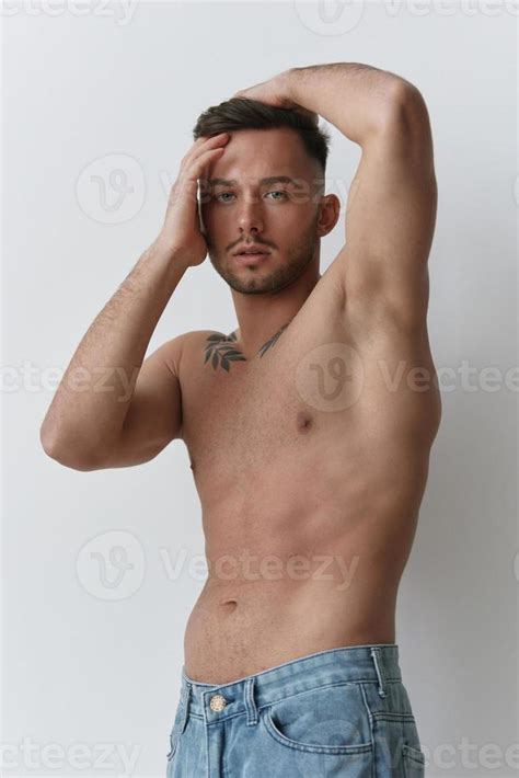 Sporty Sexy Muscular Handsome Naked Man Holds Hands On Head Posing