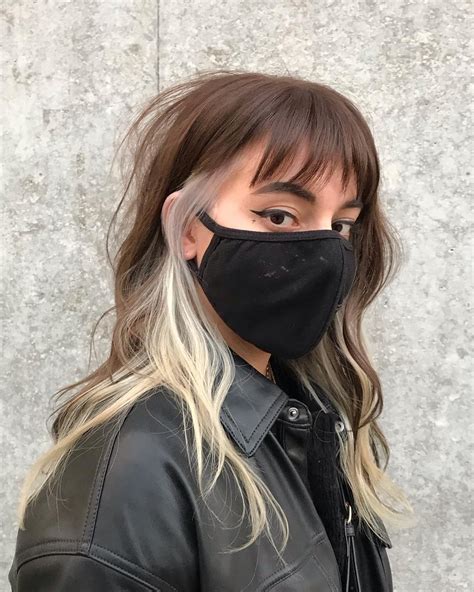 Brown Hair With Blonde Peekaboo Highlights In Bangs