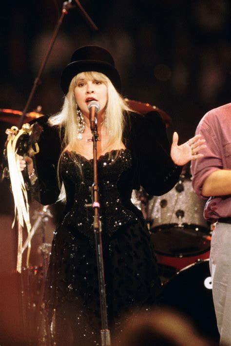 24 Candid Photographs Of Stevie Nicks On Stage With Her Trademark Top Hat And Tambourine
