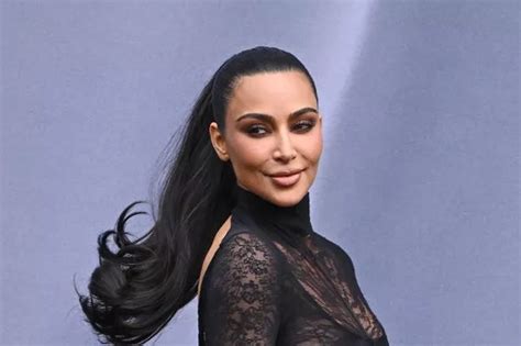 Kim Kardashian Shows Off Hourglass Curves In Backless Lace Dress At