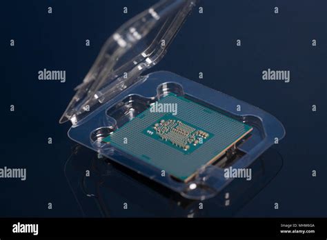 Central Processing Unit CPU Processor Microchip In The Packaging Box On Black Background Stock