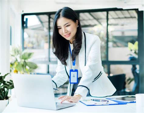 Asian Businesswoman Calculate Financial Graphs Showing Results About