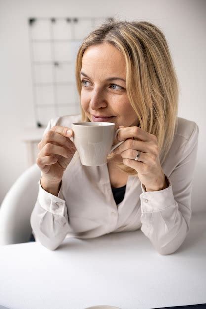 Premium Photo Young Woman Drinking Coffee
