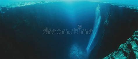 Underwater Waterfall Cascading Into Deep Blue Abyss Revealing Nature S