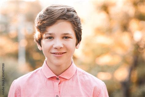 Smiling Teen Boy 14 15 Year Old Wearing Pink Shirt Posing Over Nature