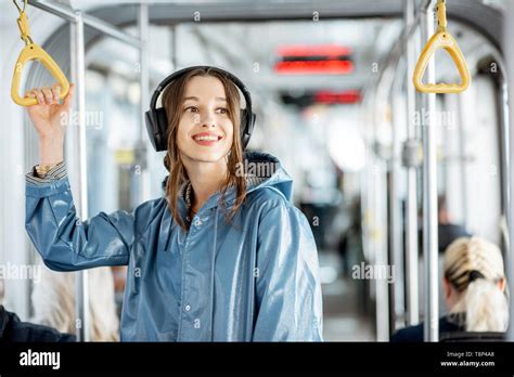 Young Stylish Woman Enjoying Trip In The Public Transport Standing