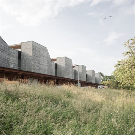 Seven Wood Clad Boxes Outline Industrial Buildings Facade In Italy