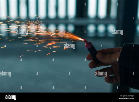 Burning Firecracker With Sparks Guy Holding A Petard In A Hand Loud
