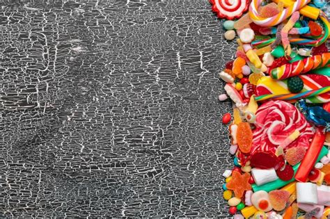 Premium Photo Colorful Candies On Old Background