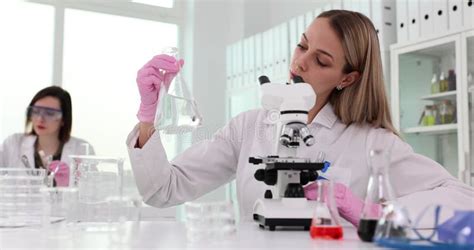 Scientist Man And Flask With Liquid On Gas For Danger In Lab As Experiment With Nitrogen