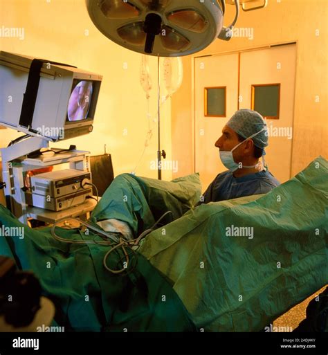 Endoscopy Surgeon Using An Endoscope To Take A Tissue Sample Biopsy Of A Patient S Suspected