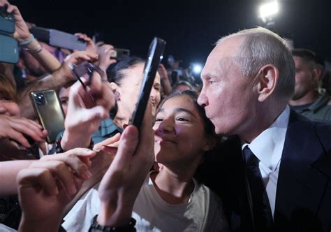 Putin Kissing Fans Sparks Body Double Conspiracy Theory Newsweek