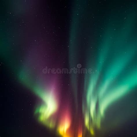 Aurora Borealis Display Against A Starry Night Sky Vibrant Colors Of