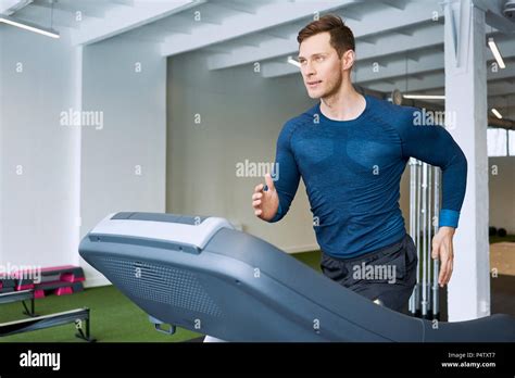 Man Running On Treadmill At Gym Stock Photo Alamy