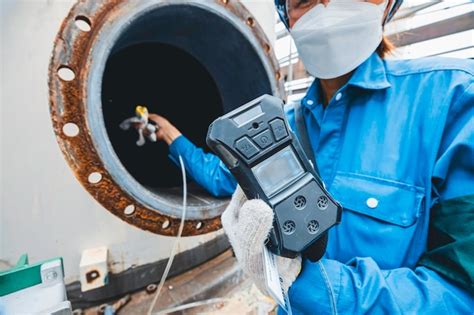 Premium Photo Worker Female Hand Holding Gas Detector Inspection Safety Gas Testing At Front